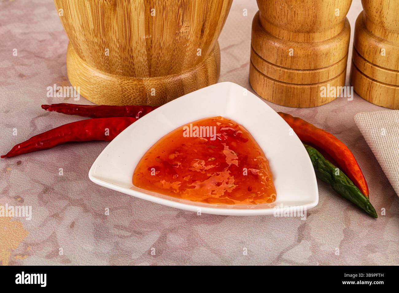 Sweet and sour chili sauce with pineapple pieces Stock Photo - Alamy