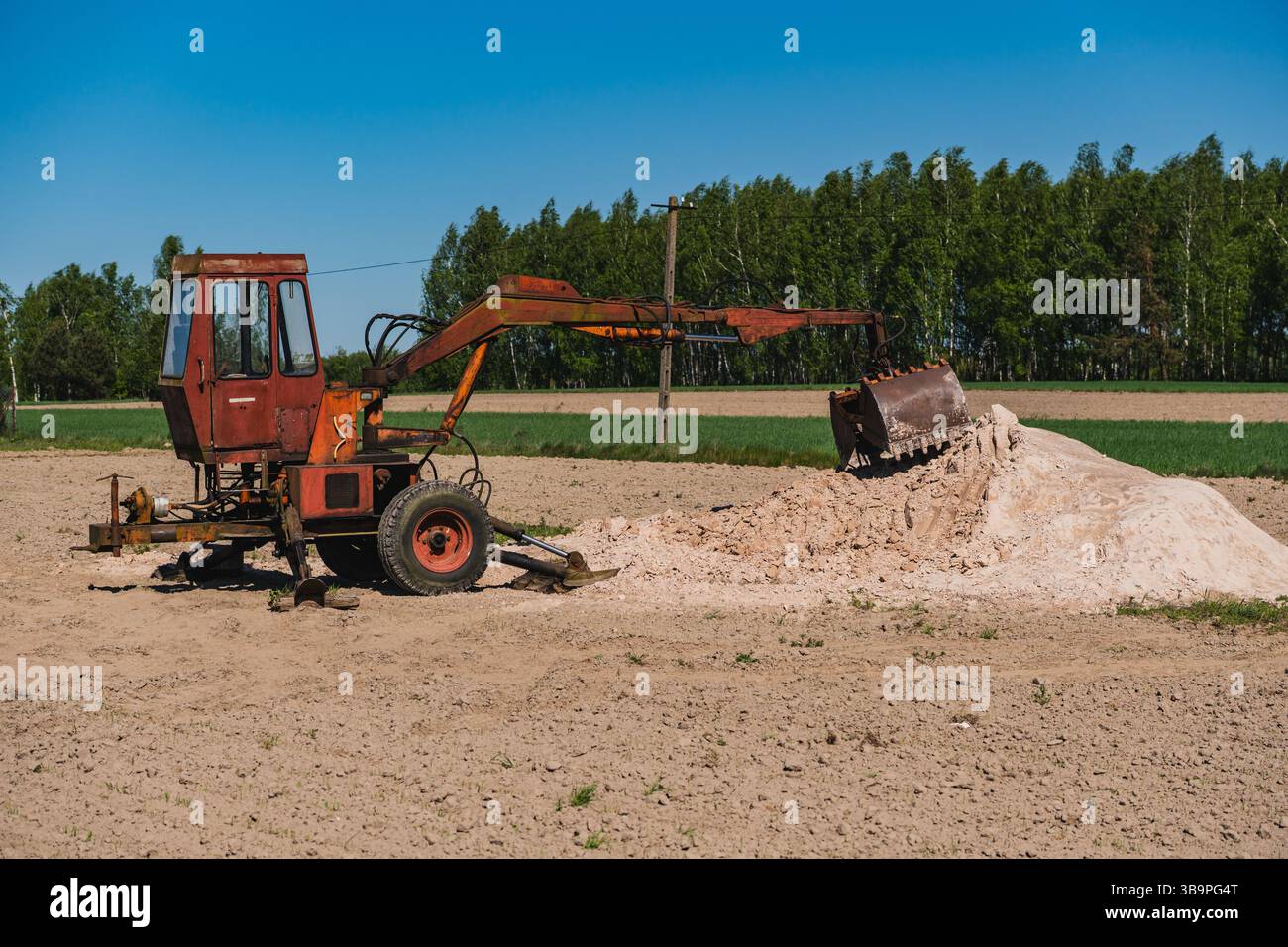 Old sand loading machine stands abandoned next to its pile Stock Photo ...
