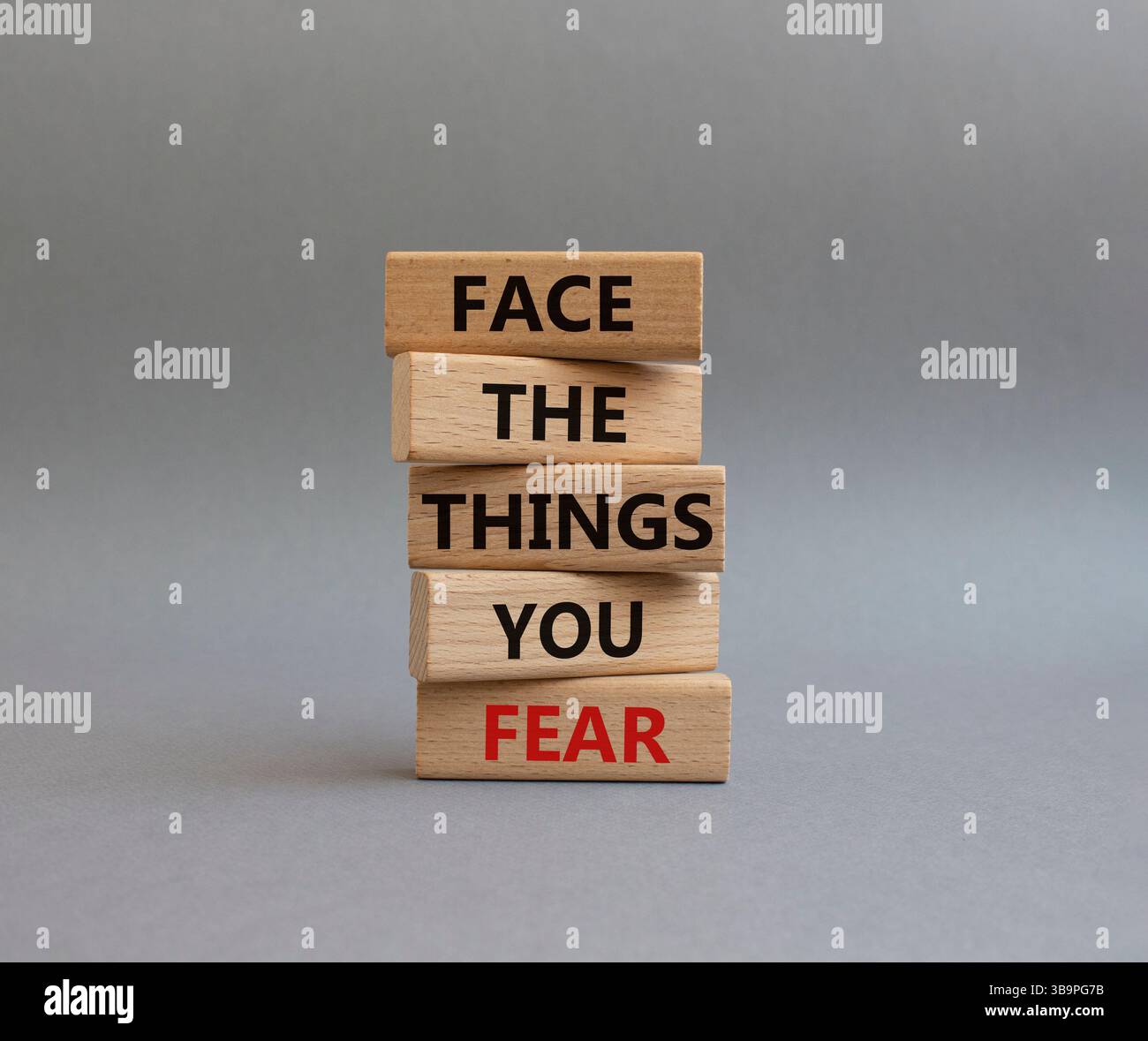 Face the things you fear symbol. Wooden blocks with words Face the ...