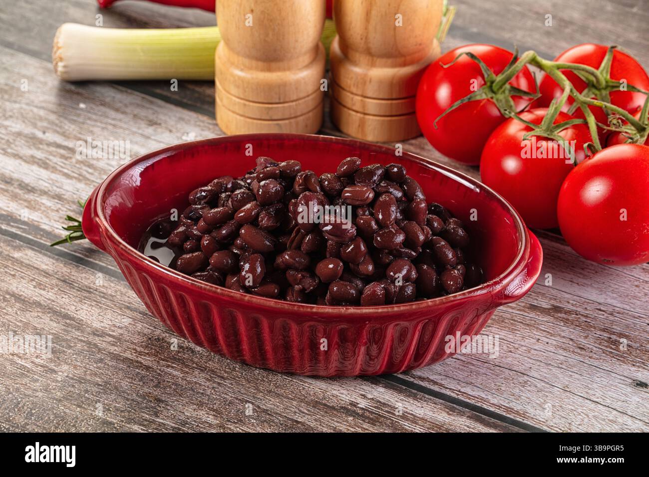 Canned boiled black beans in the bowk Stock Photo - Alamy