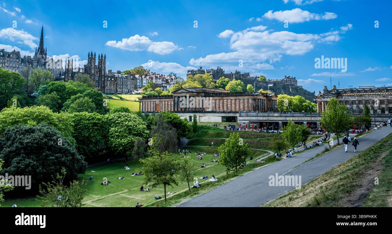 People enjoying the warm spring sunshine in Princes Street Gardens in ...