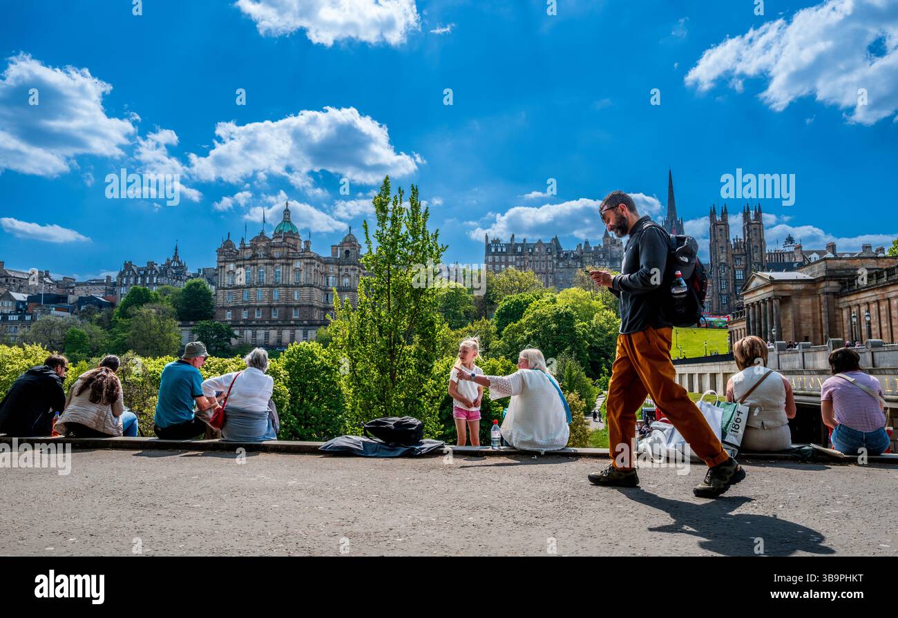 People enjoying the warm spring sunshine in Princes Street Gardens in ...
