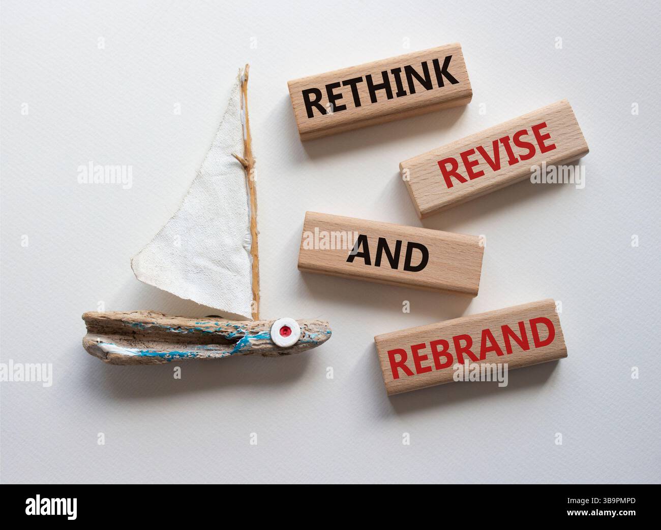 Rethink Revise and Rebrand symbol. Wooden blocks with words Rethink Revise and Rebrand ...