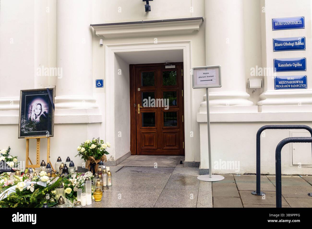 Flowers at the murder site at the University of Warsaw. the entrance to ...