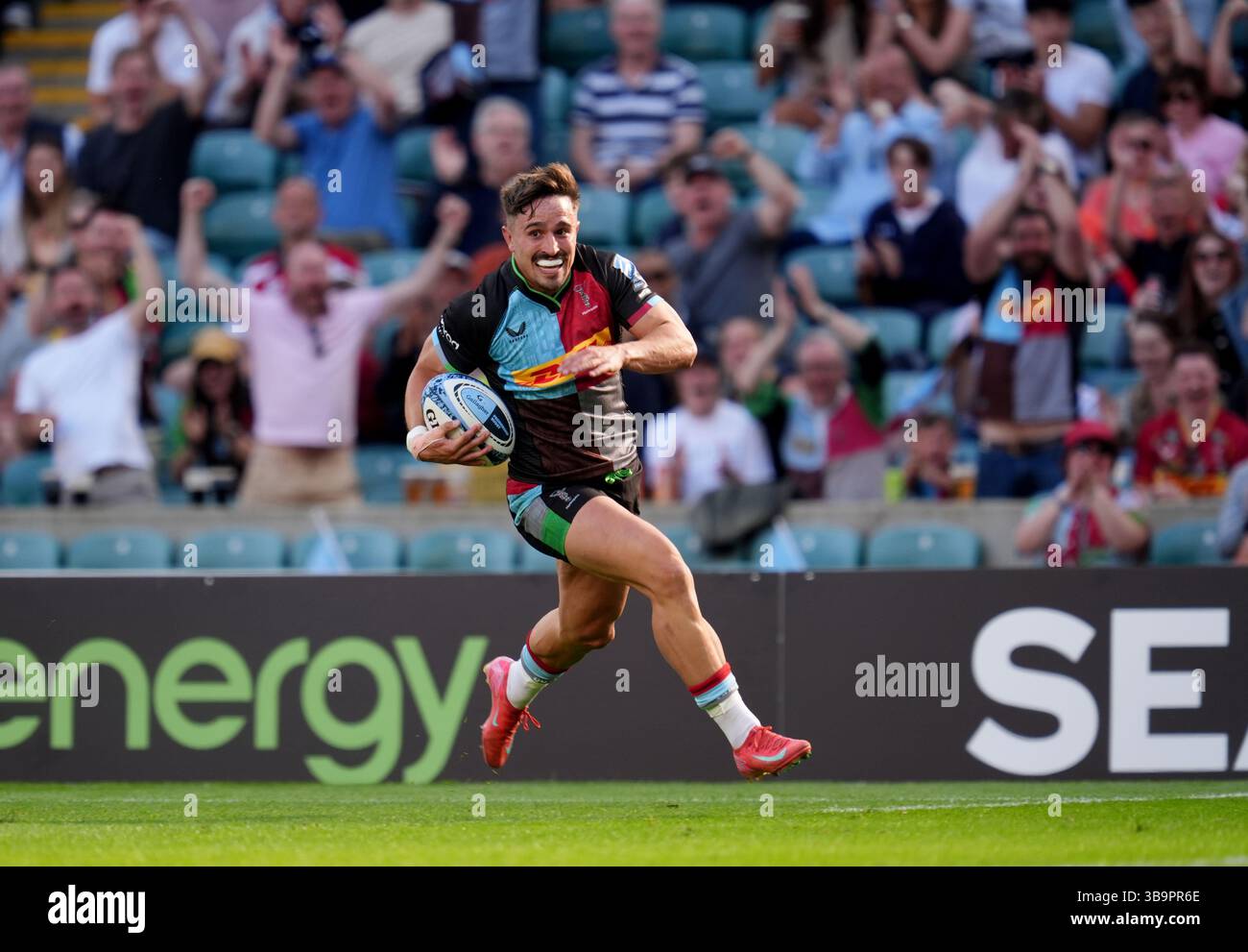 Harlequins' Cadan Murley runs in to score his teams first try during ...