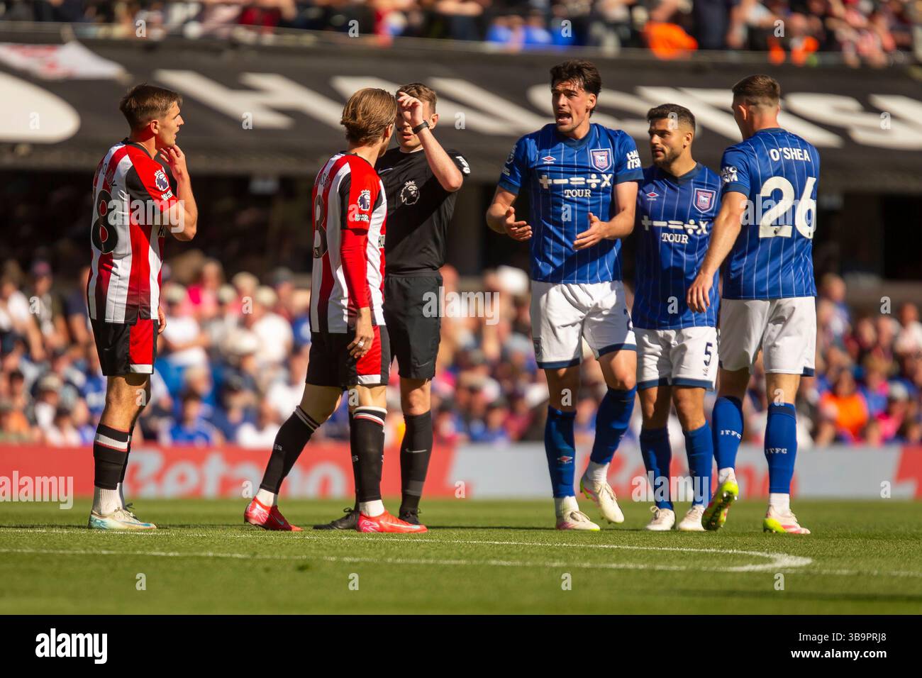 Jacob Greaves of Ipswich Town interacts with Referee Sam Barrott during ...