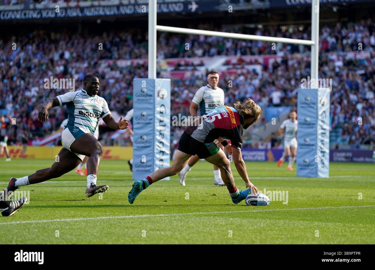Harlequins' Tyrone Green drops the ball before touching it down during ...