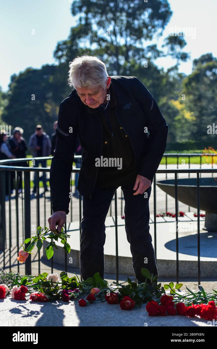 Man seen laying flowers hi-res stock photography and images - Alamy