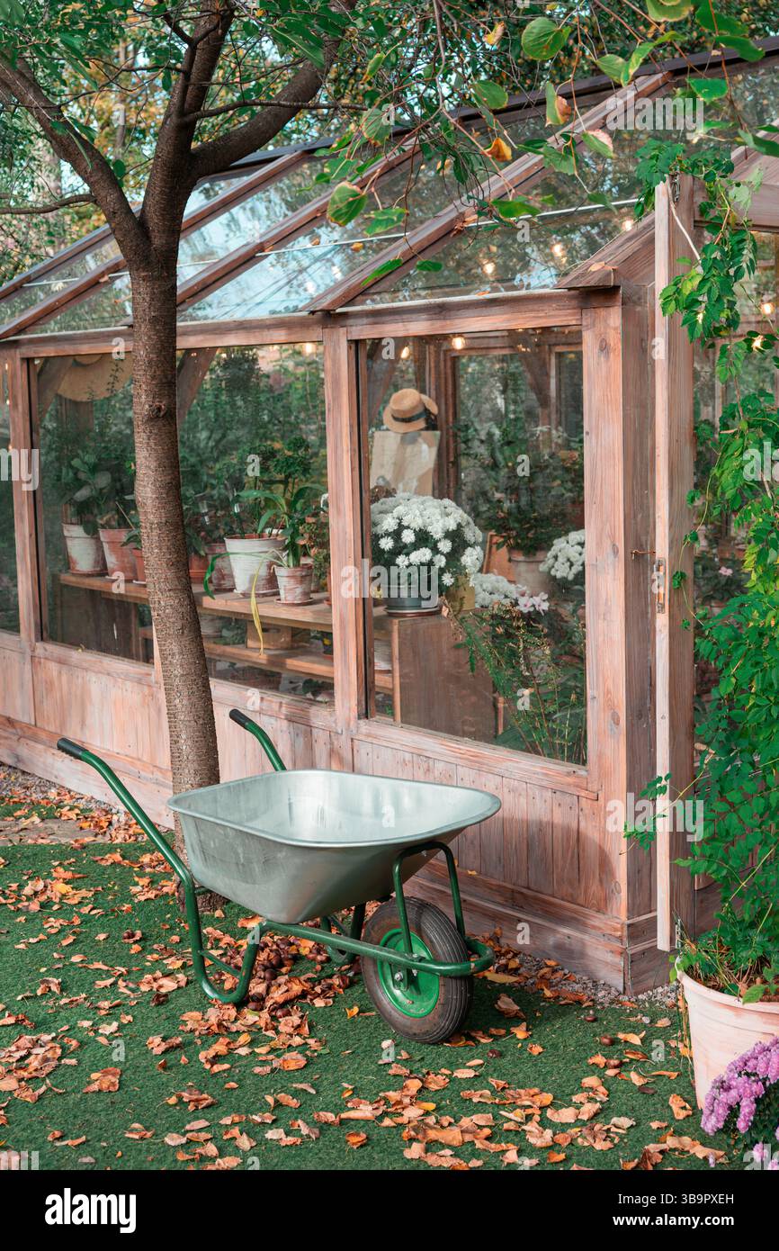 Wheelbarrow filled plants in hi-res stock photography and images - Alamy