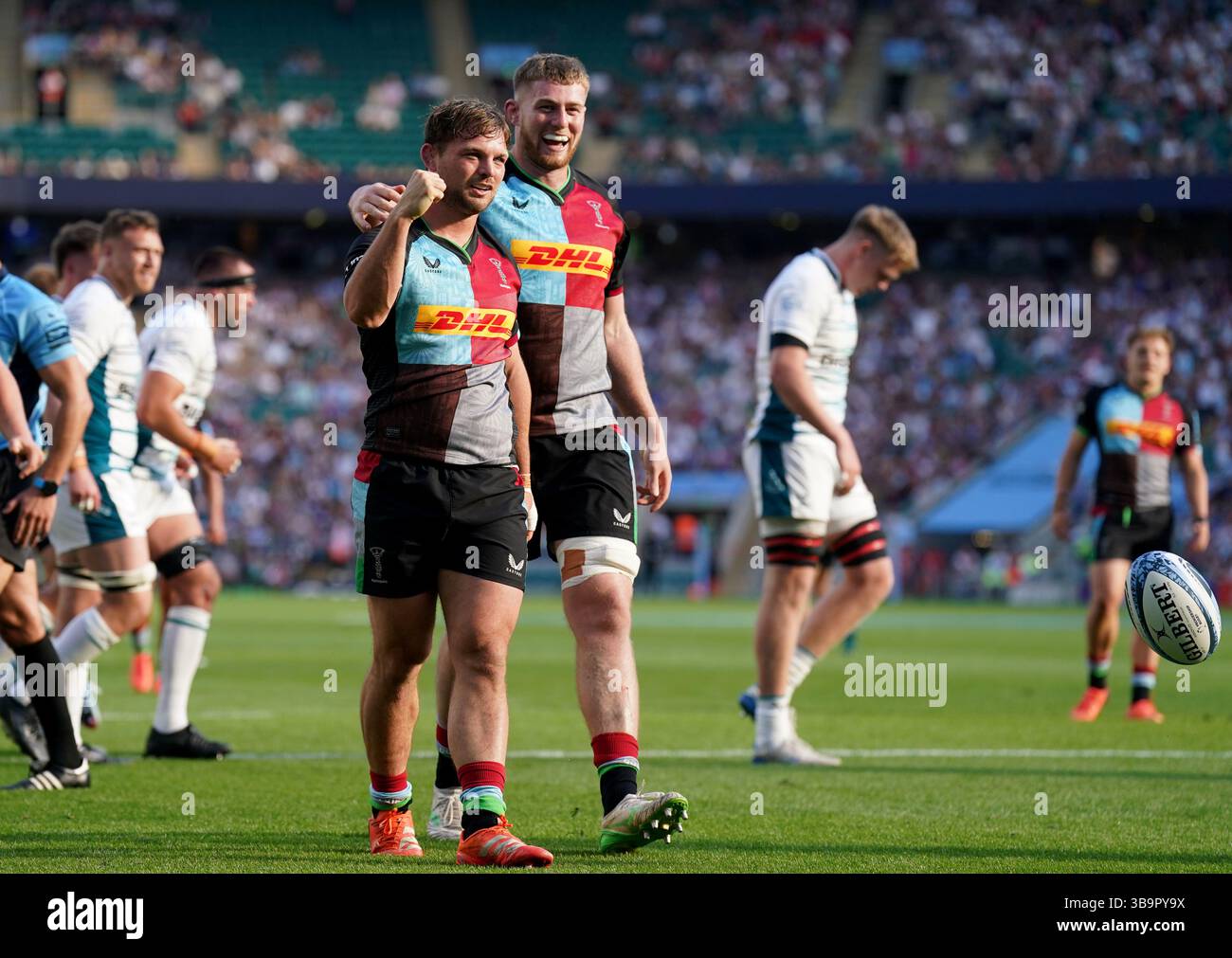 Harlequins' Will Evans (left) celebrates after scoring his sides second ...