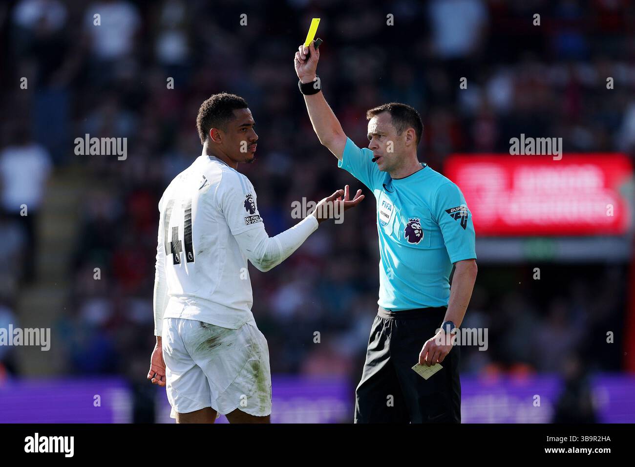 Aston Villa's Jacob Ramsey (left) is shown a yellow card by referee ...