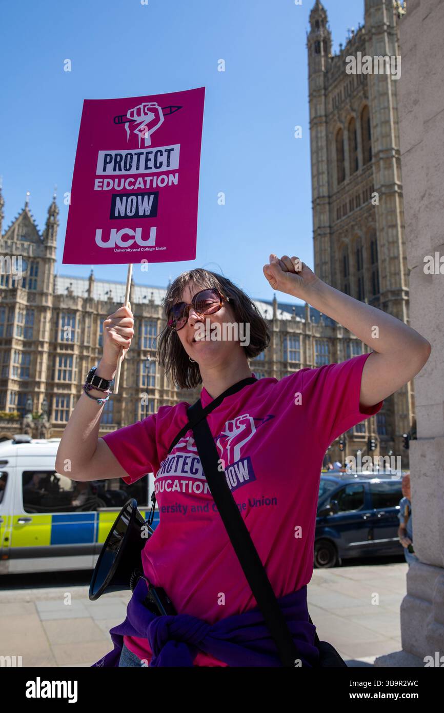 London, UK, 26th April 2025. A member of the UCU holds a placard ...
