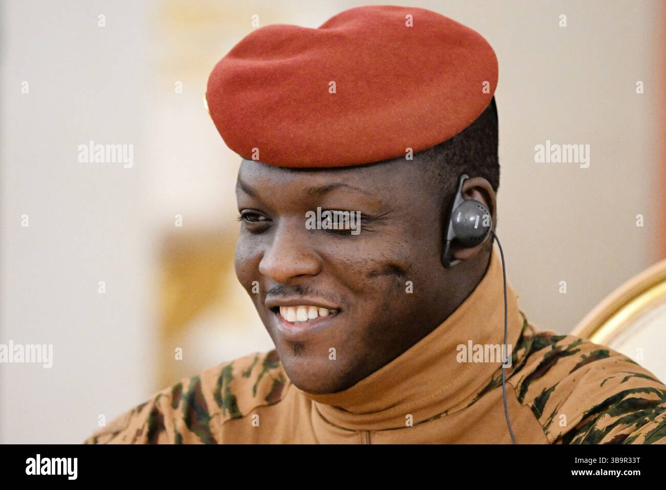 Burkina Faso President Ibrahim Traore smiles while speaking to Russian ...