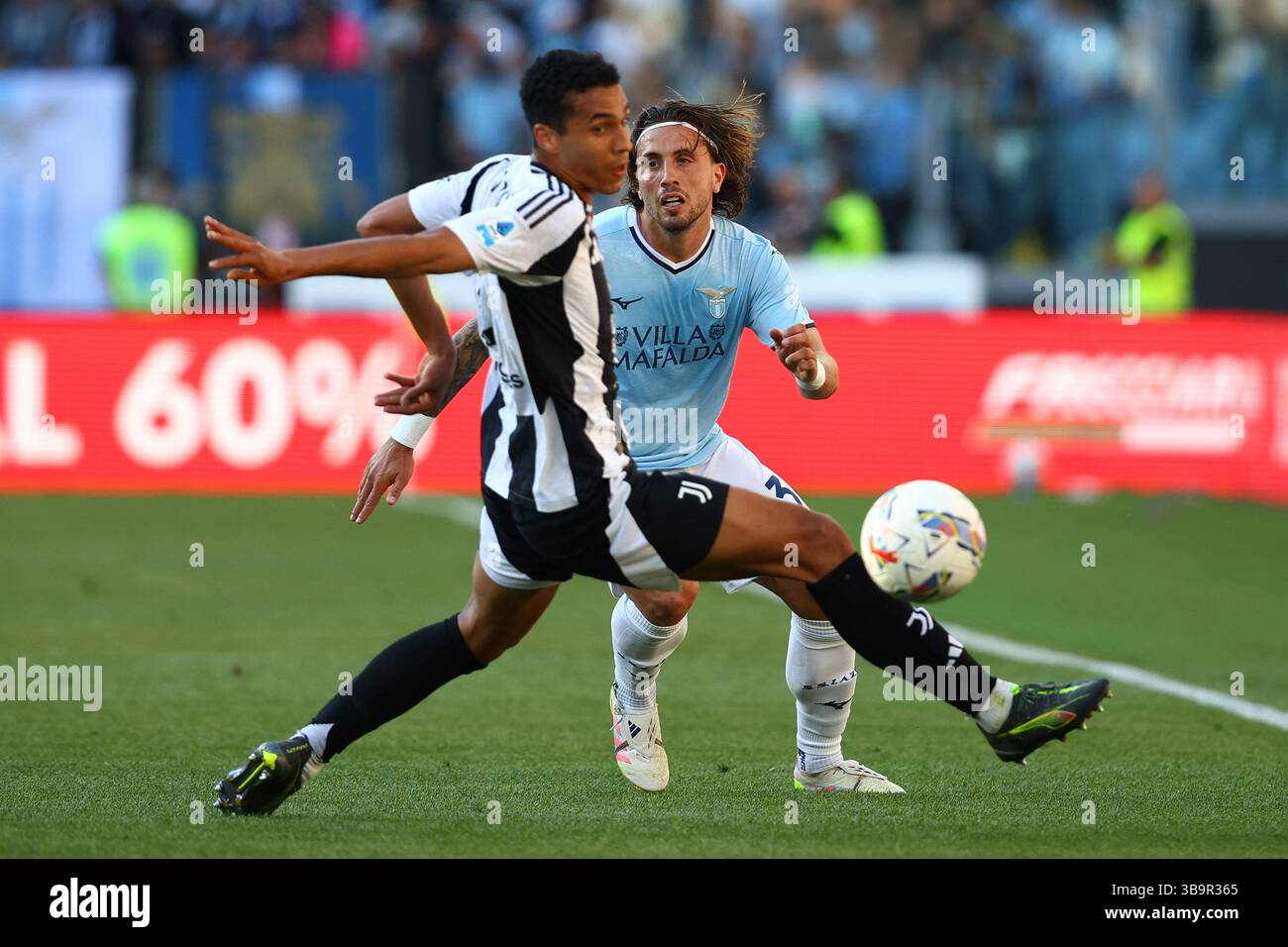 Rome, Italy. 10th May, 2025. Luca Pellegrini of Lazio vies for the ball with Alberto Costa of ...