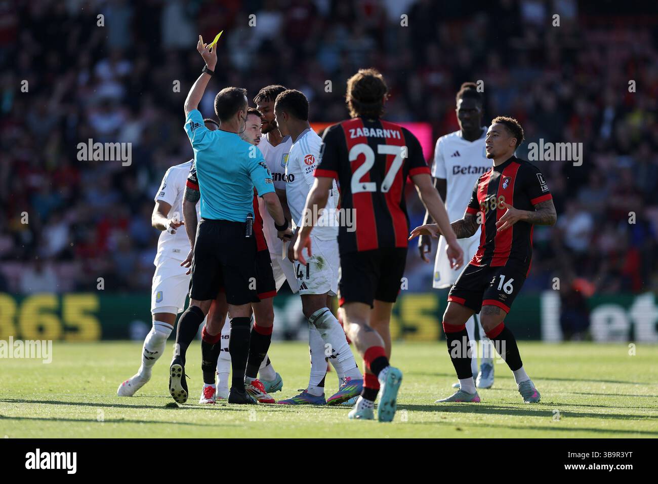 Bournemouth's Adam Smith (second left) is shown a yellow card by ...