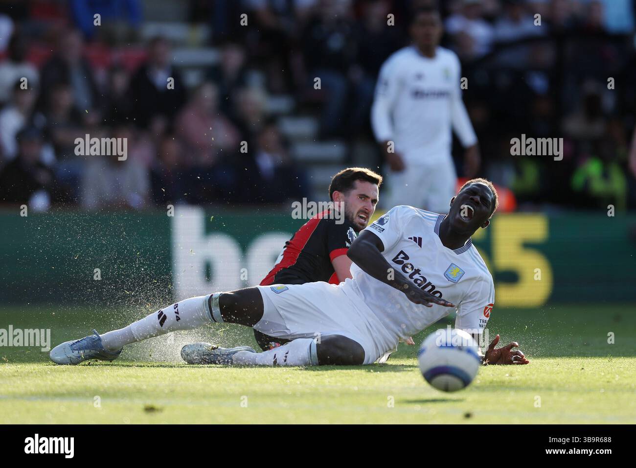Aston Villa's Amadou Onana (right) is tackled by Bournemouth's Lewis ...