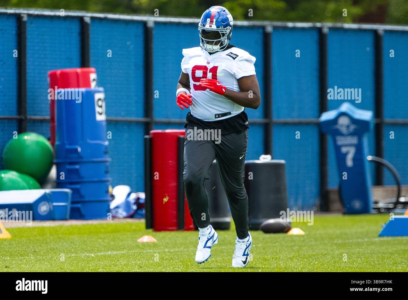 New York Giants defensive tackle Darius Alexander (91) runs drills at ...