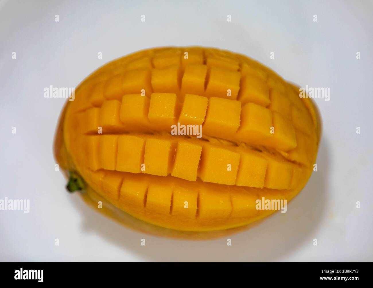Ripe rosa mango isolated on uniform background. Brazilian fruit and ...