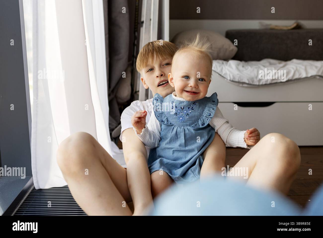 Little sister with brother. Portrait of happy smiling Children, loving ...