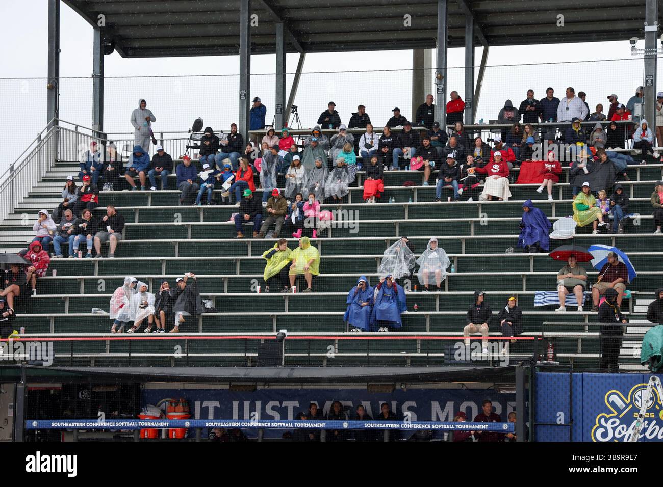 ATHENS, GA - MAY 10: Fans sit in the rain ahead of the SEC Softball Championship game between ...