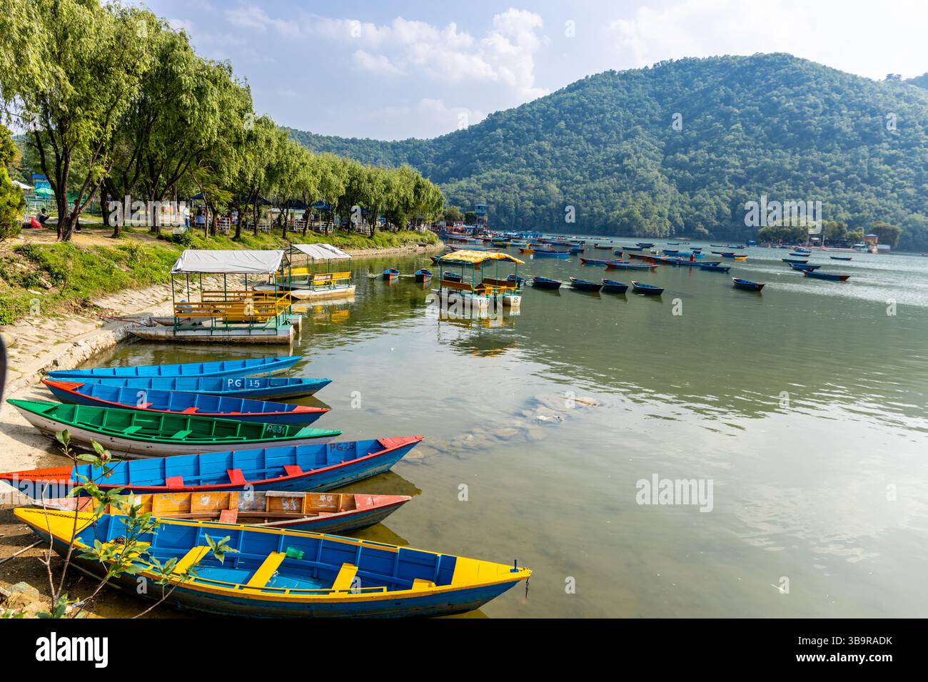 Boats on Phewa lake, Fewa lake in Nepal. Colorful boats attraction and ...