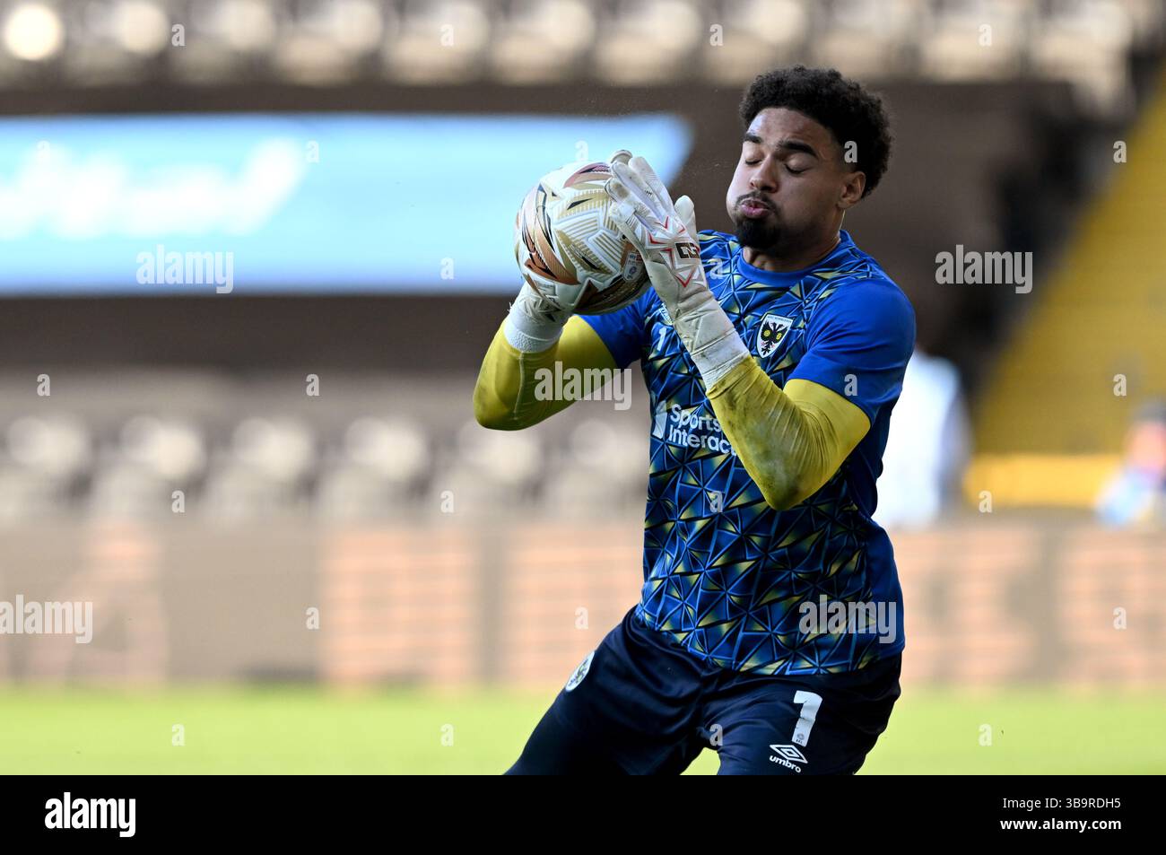 AFC Wimbledon goalkeeper Owen Goodman warming up before the Sky Bet ...
