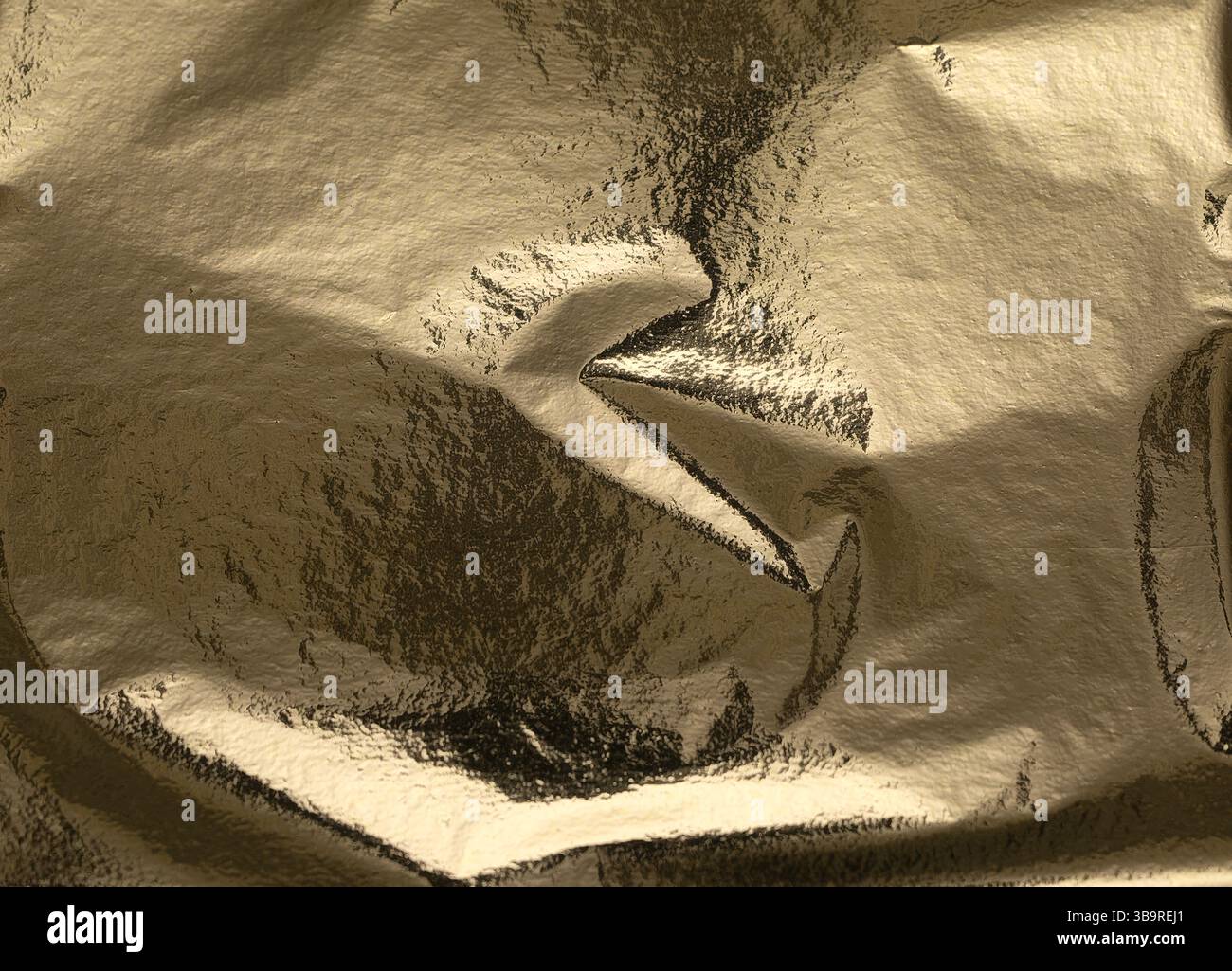 Gold foil texture with crumpled, folded metallic surface. Shiny ...