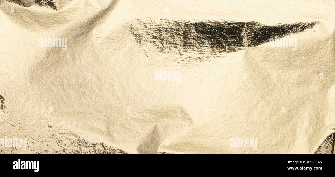 Gold metallic foil texture background. Soft, pale golden surface with a ...