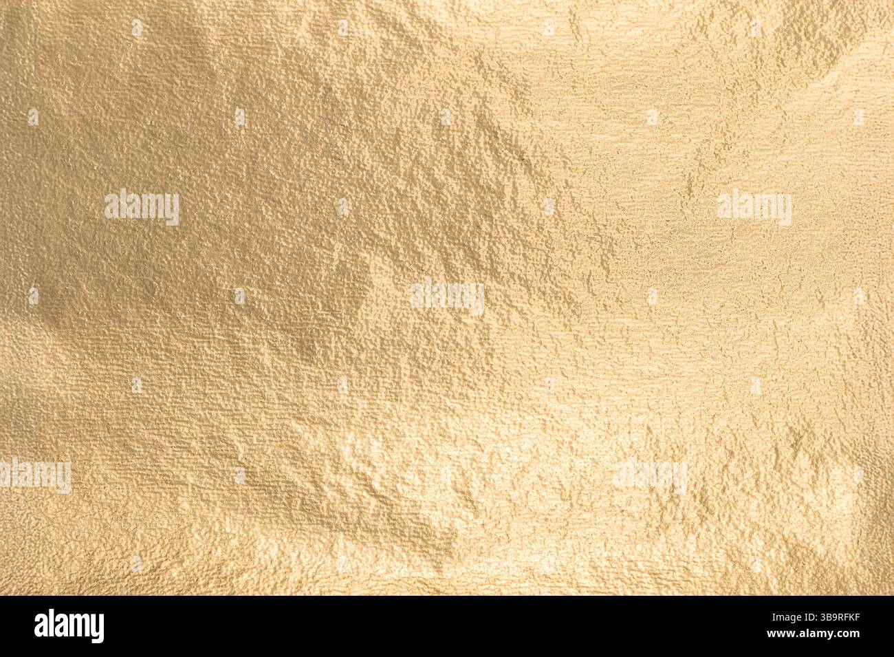 Gold metallic foil texture with a smooth, soft surface. Shiny, glowing ...
