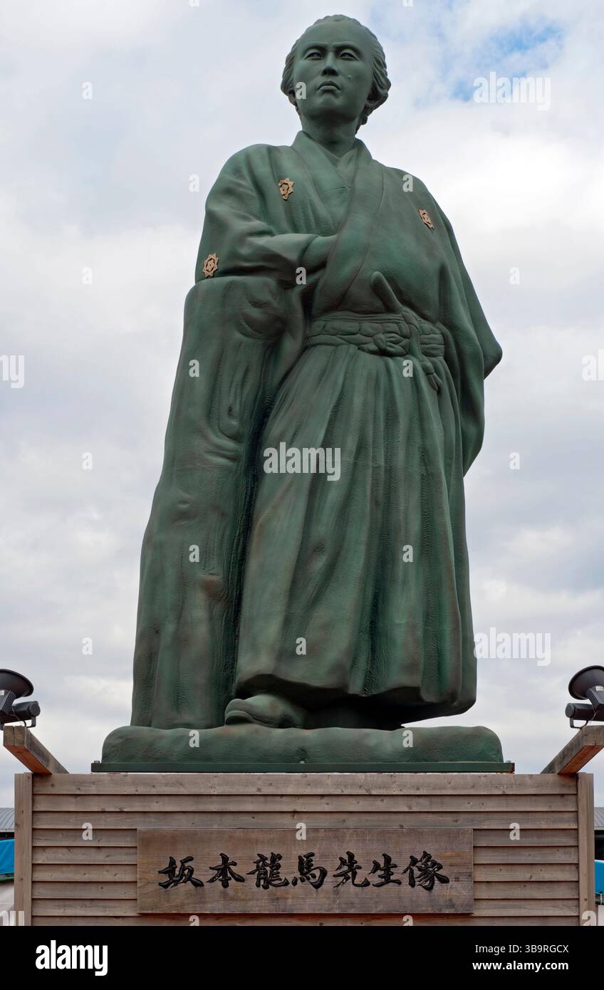 Bronze statue of Tosa samurai warrior Sakamoto Ryoma standing in front of Kochi Station in ...