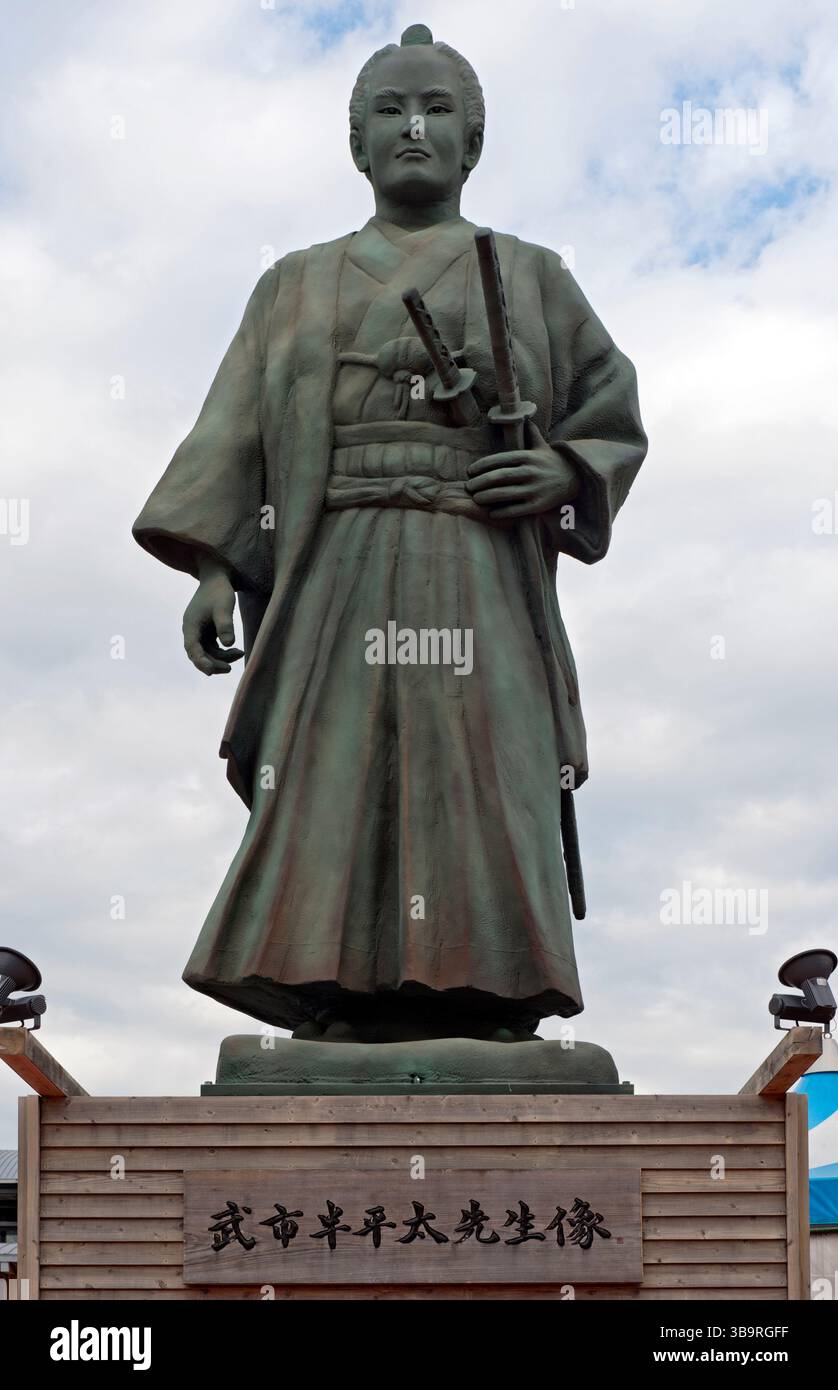 Bronze statue of Tosa samurai warrior Hanpeita Takechi standing in front of Kochi Station in ...
