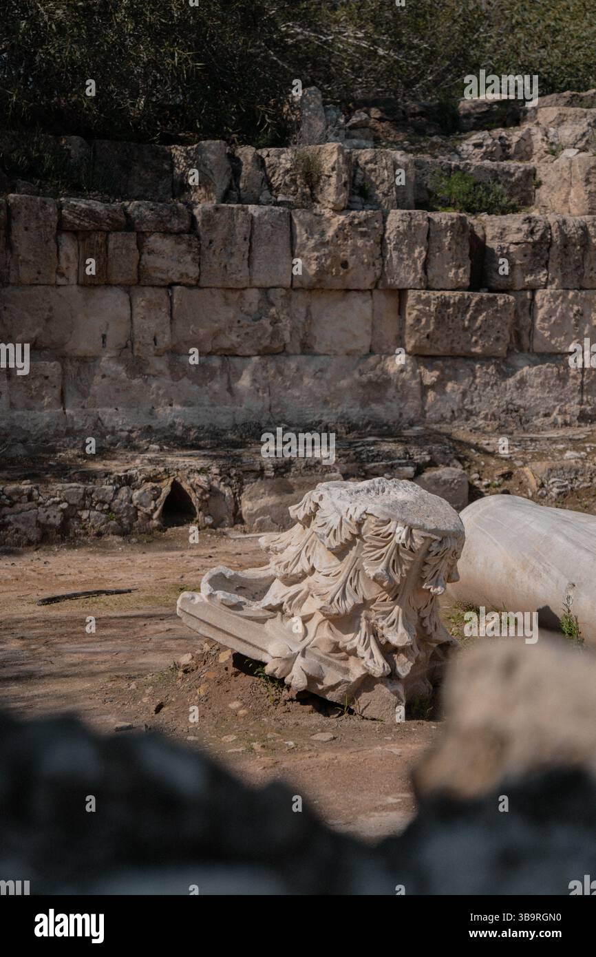 Ancient Greco-Roman ruins with marble columns and carved stone remains ...
