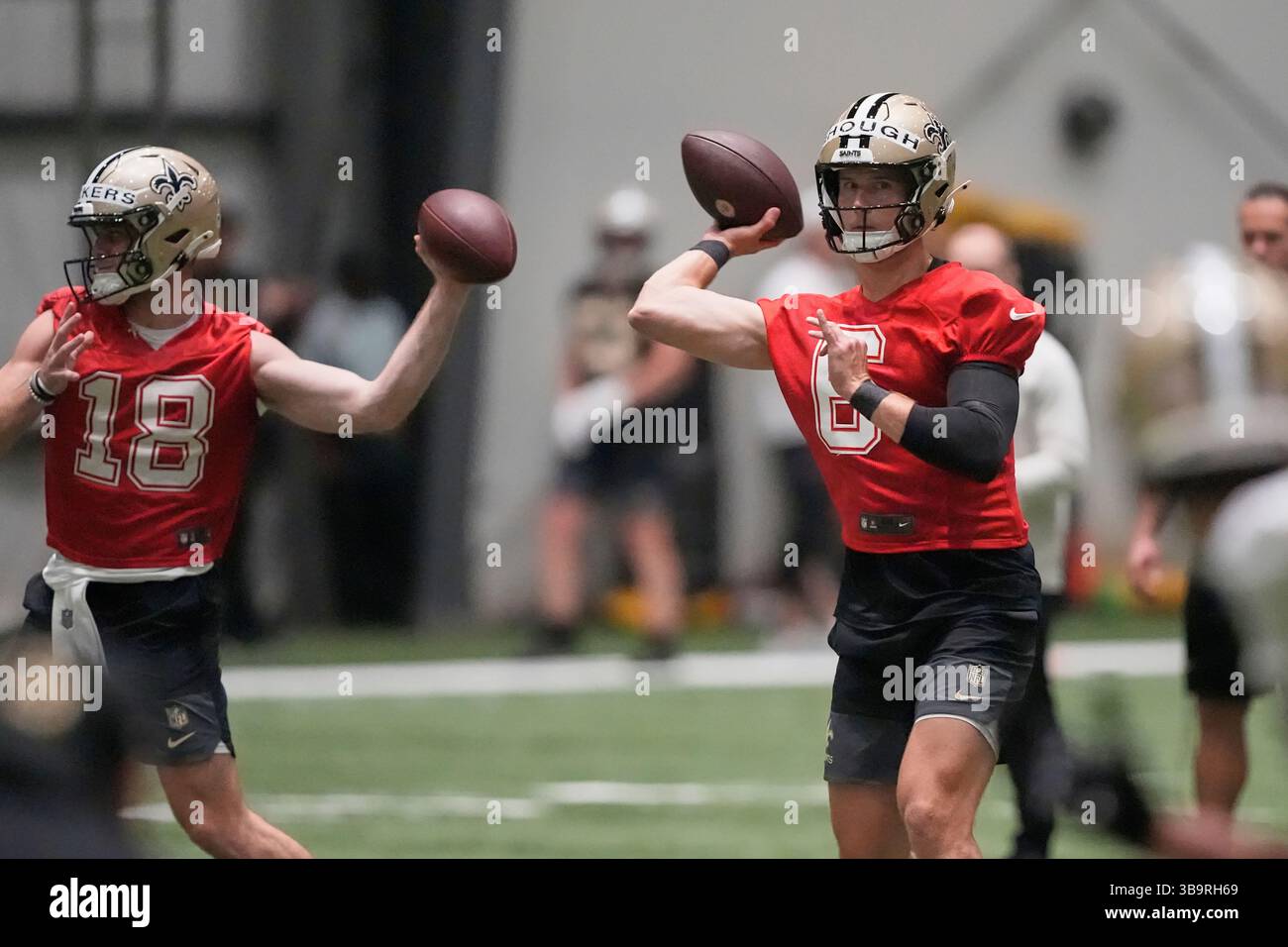 New Orleans Saints quarterbacks Tyler Shough (6) and Hunter Dekkers (18 ...