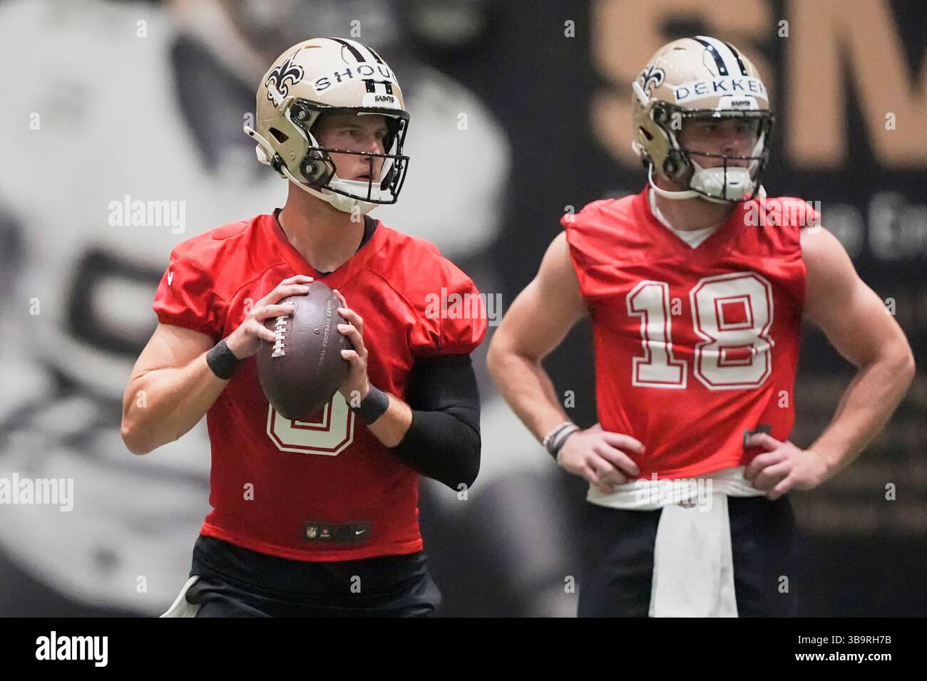 New Orleans Saints quarterbacks Tyler Shough (6) and Hunter Dekkers (18 ...