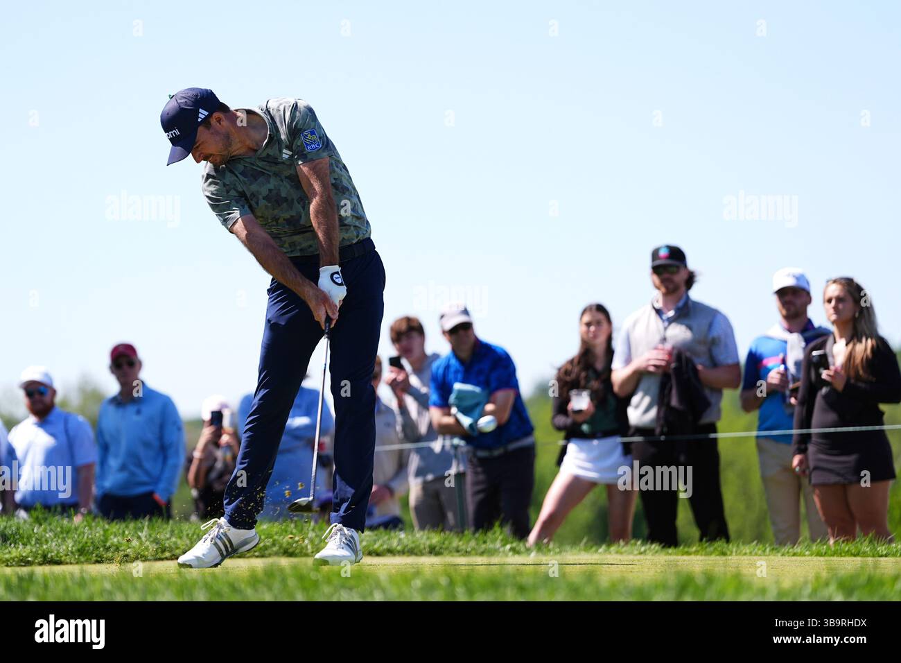 Nick Taylor, of Canada, hits on the 13th hole during the third round of ...
