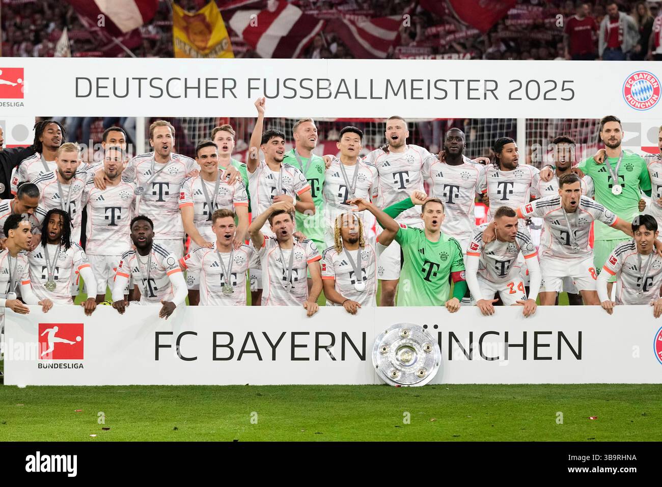 Bayern Munich players celebrate with the championship shield after the ...