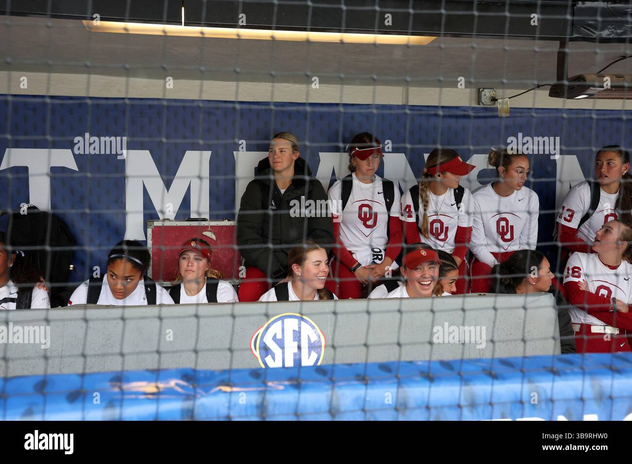 ATHENS, GA - MAY 10: Oklahoma players sit in the dugout after the cancellation of the SEC ...