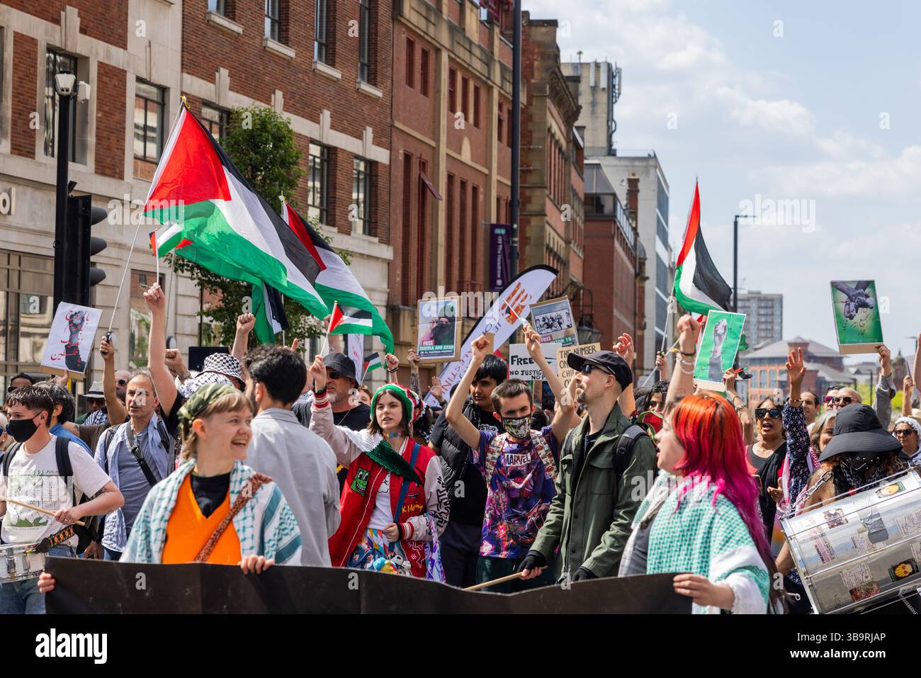 Leeds, UK. 10 MAY, 2025. Activists make their way through Leeds as ...
