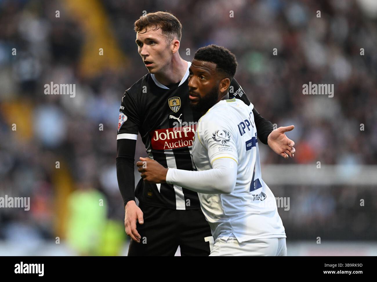 Notts County's Conor Grant (left) and AFC Wimbledon's Myles Hippolyte ...