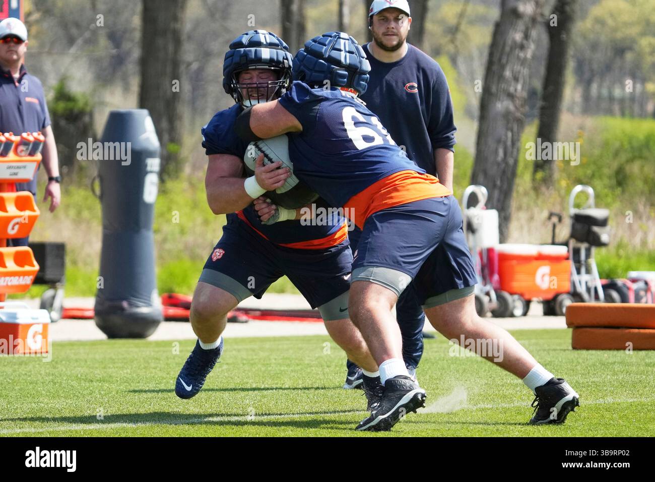 Chicago Bears offensive line Luke Newman, left, works with offensive ...
