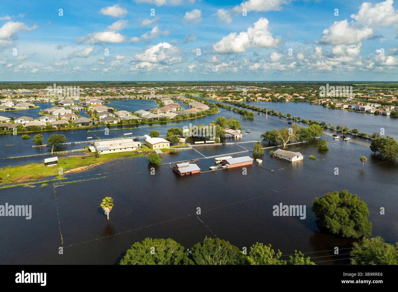 Farmland area flooded after hurricane rains. Underwater farm buildings ...