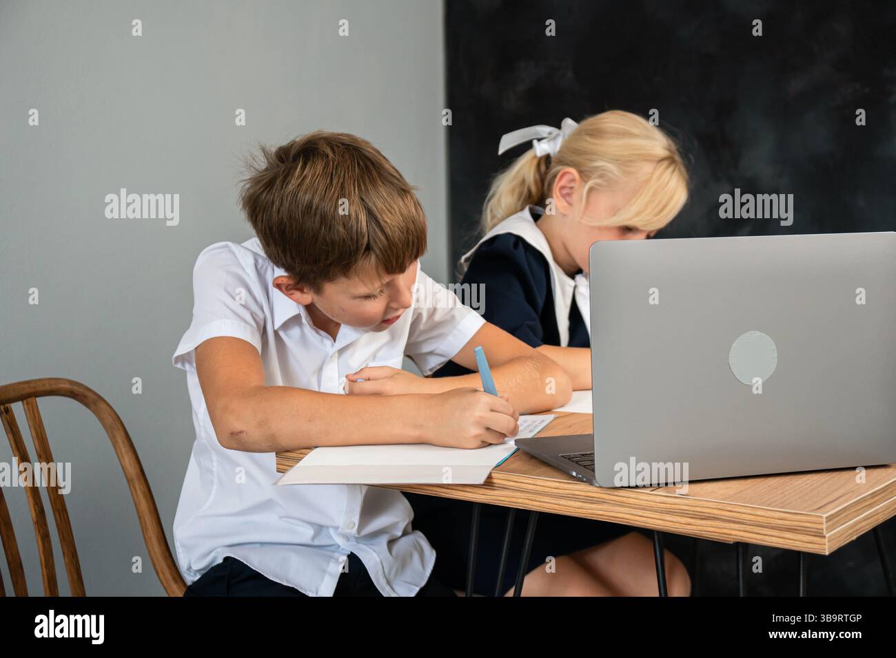 Children School Laptop Classroom - Two kids in school uniform study at ...