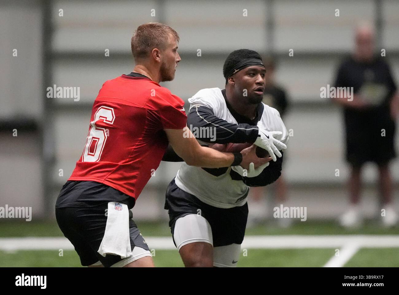 New Orleans Saints quarterback Tyler Shough (6) hands off to running ...