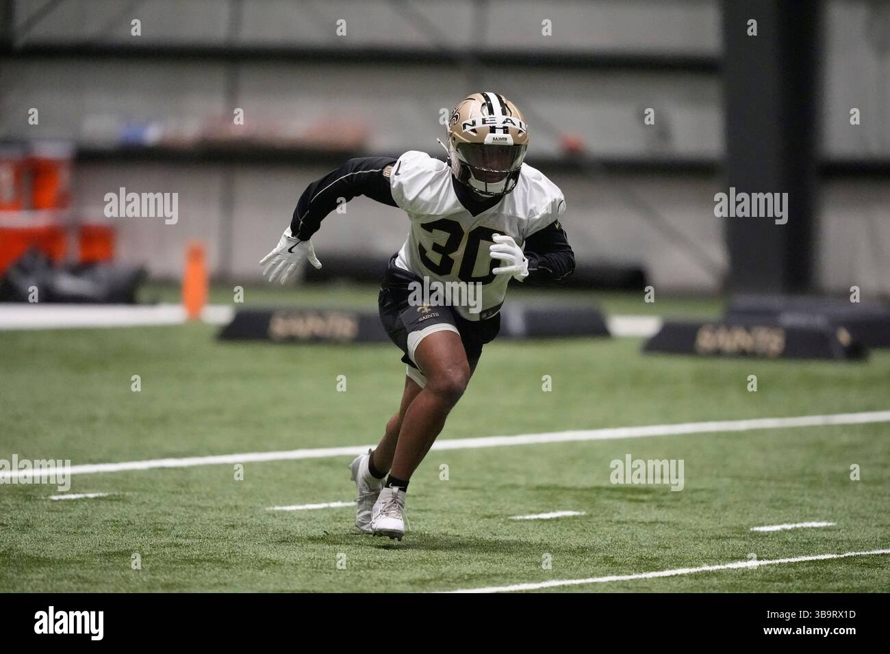 New Orleans Saints running back Devin Neal (30) goes through drills ...