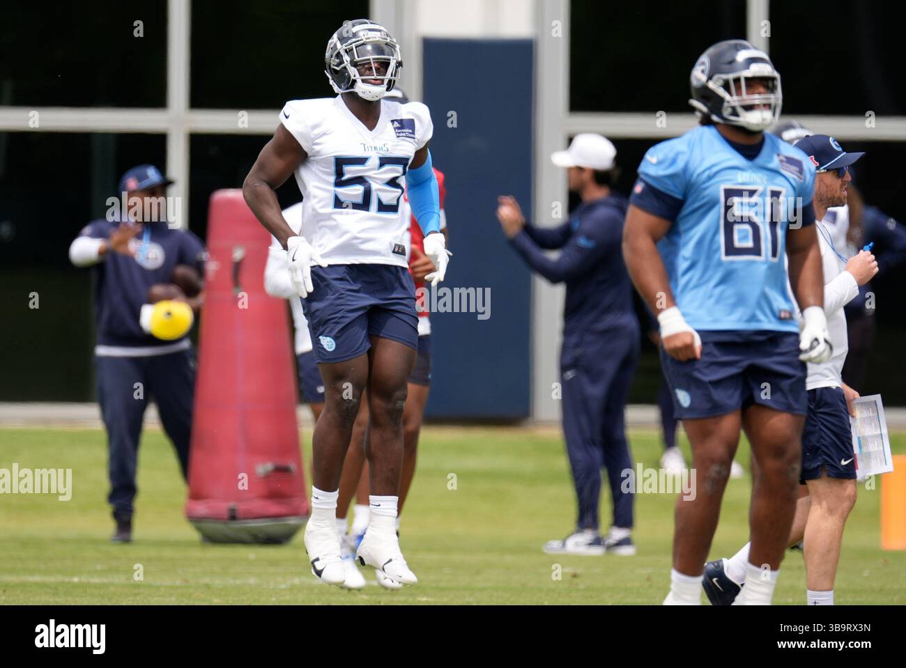 Tennessee Titans linebacker Oluwafemi Oladejo (53) and teammates warm ...
