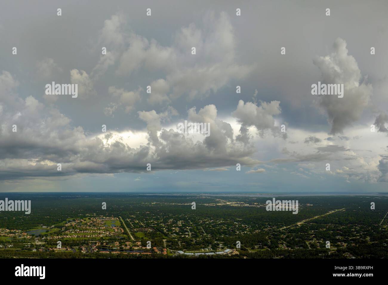 Rainstorm shower over Florida rural town in humid summer season. Rain ...