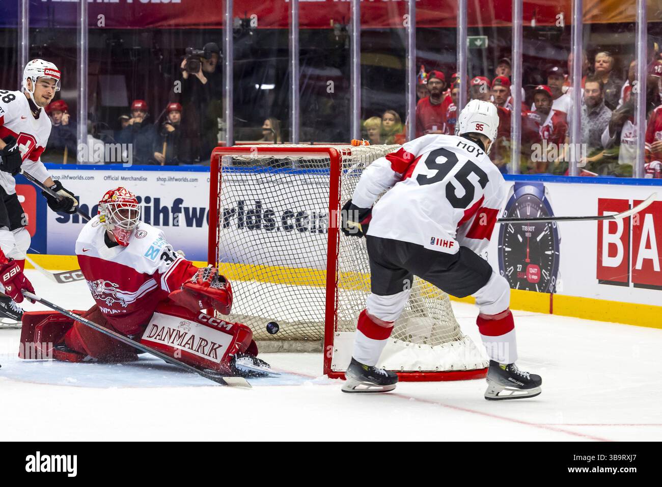 Switzerland's forward Tyler Moy (95) past Denmark's goaltender ...