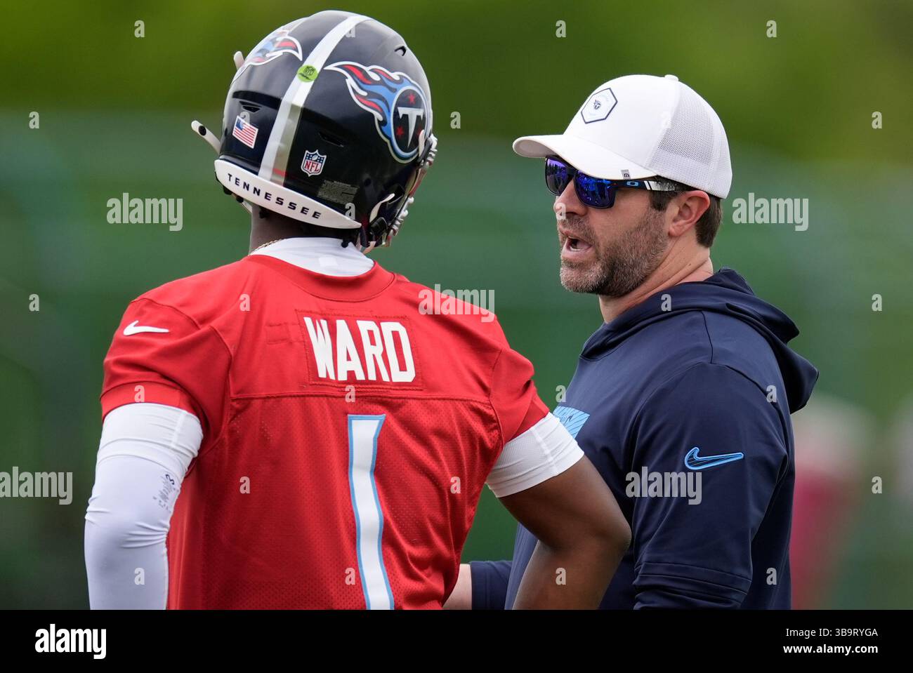 Tennessee Titans head coach Brian Callahan, right, talks to quarterback ...