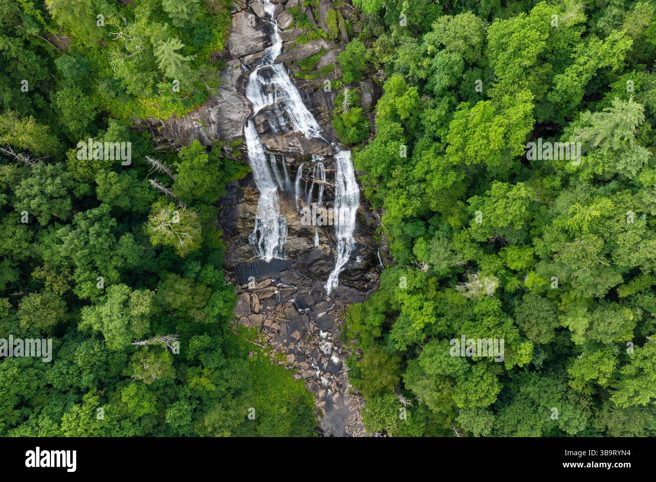 Whitewater Falls with falling down clear water from rocky boulders ...