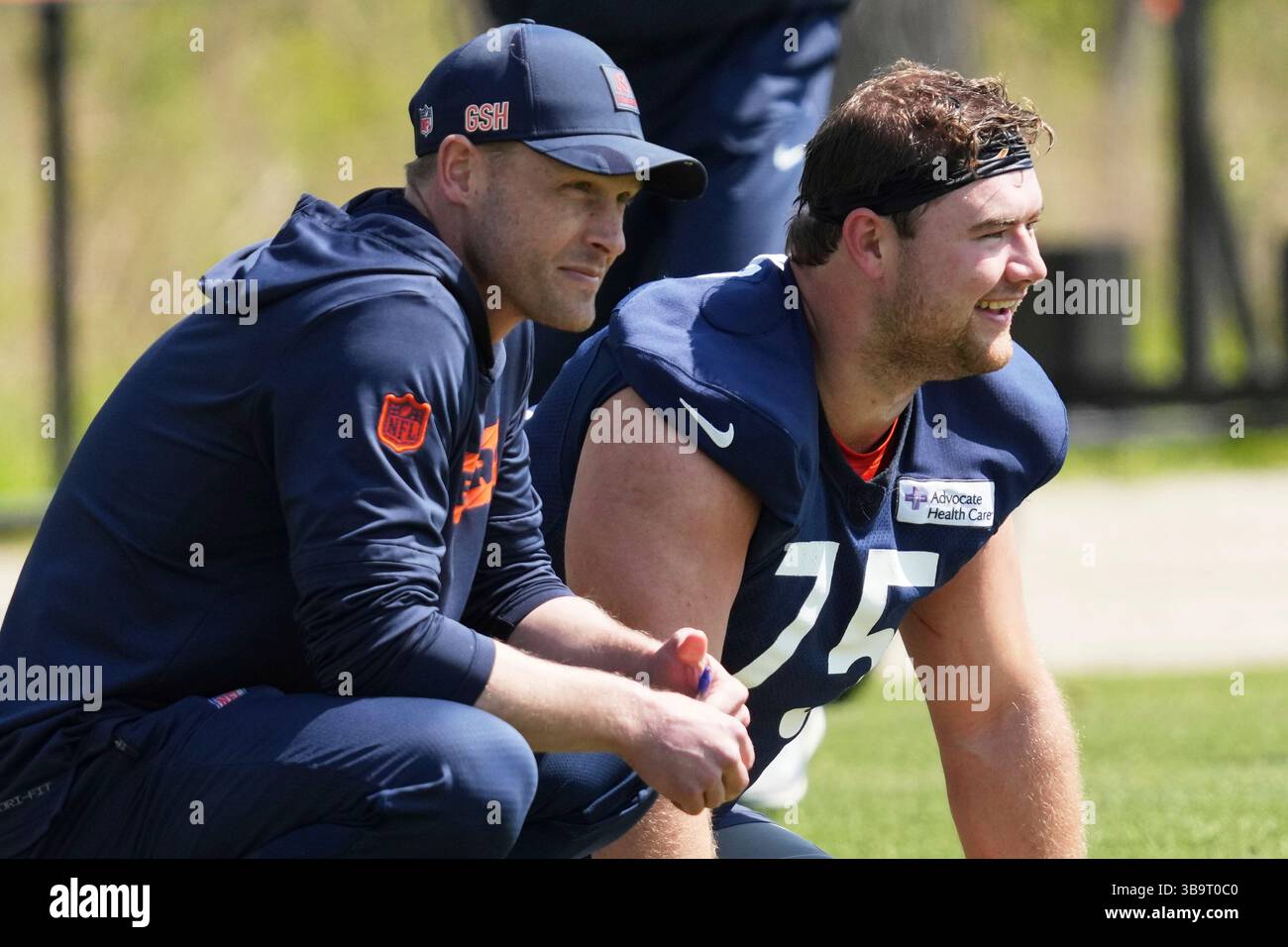 Chicago Bears head coach Ben Johnson, left, and offensive line Ozzy ...